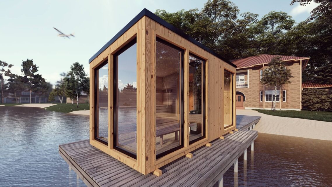Wooden frame sauna with a pitched roof, porch, and sauna area with ...